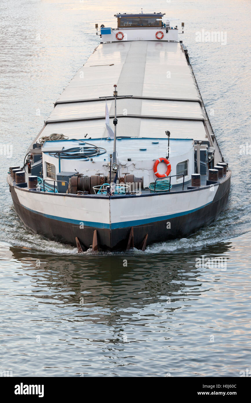 Loaded barge plying inland waterway channel Stock Photo - Alamy