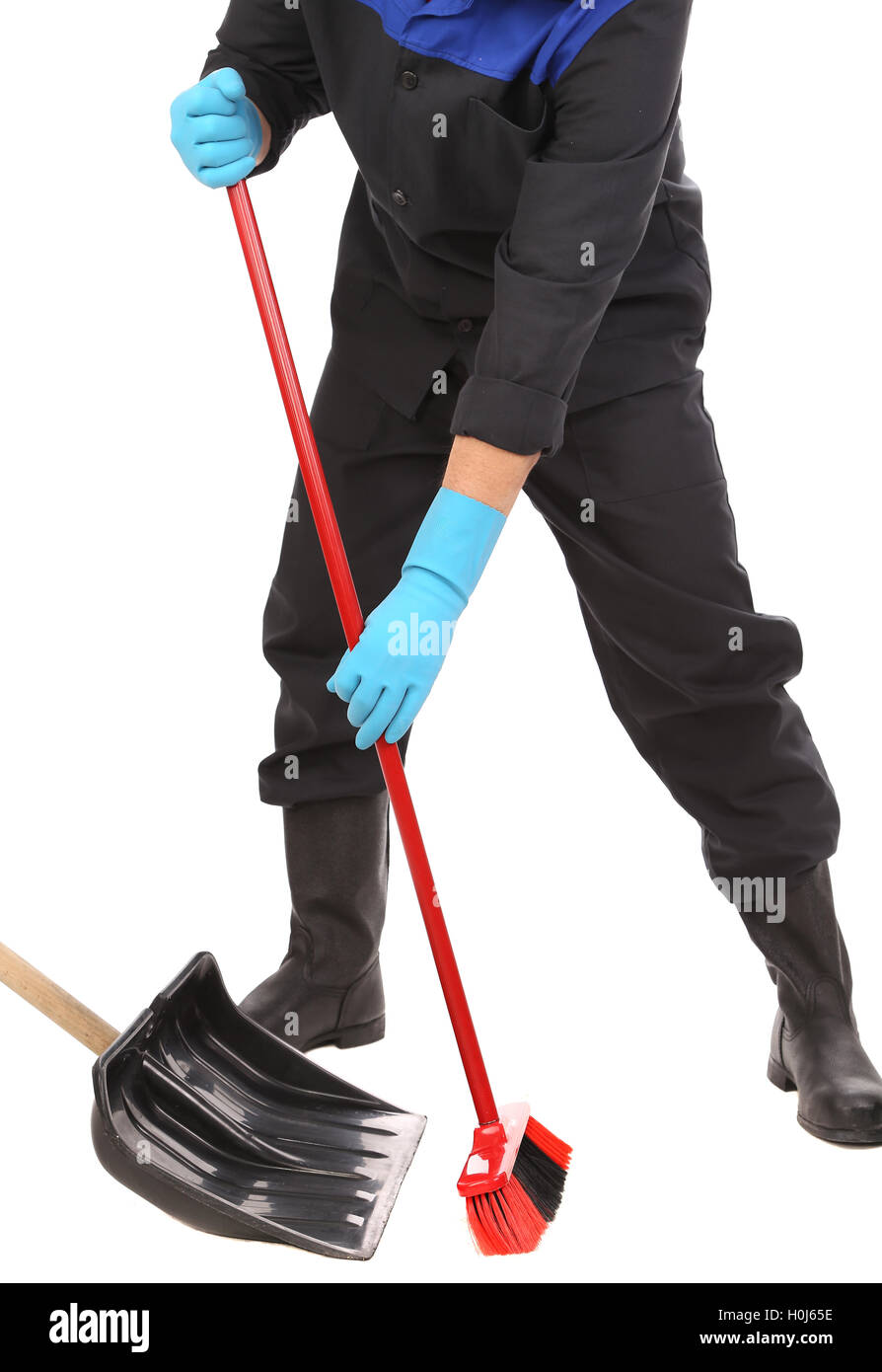 Worker sweeping floor Stock Photo - Alamy