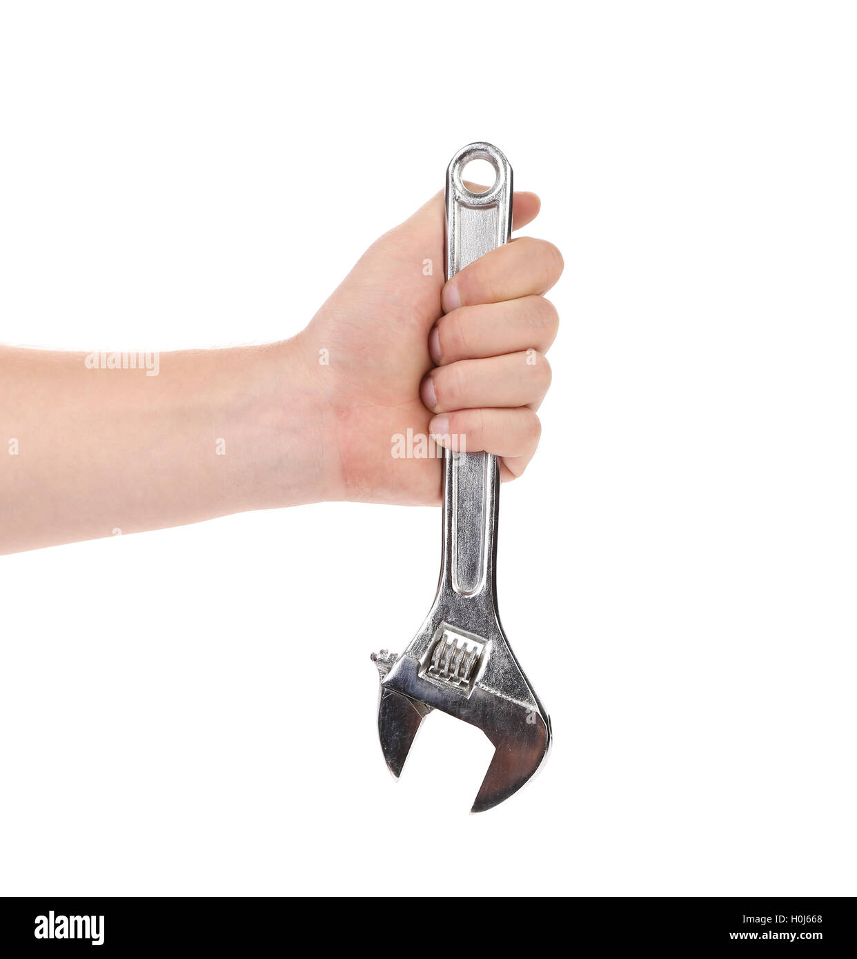 Hand holding adjustable wrench Stock Photo - Alamy