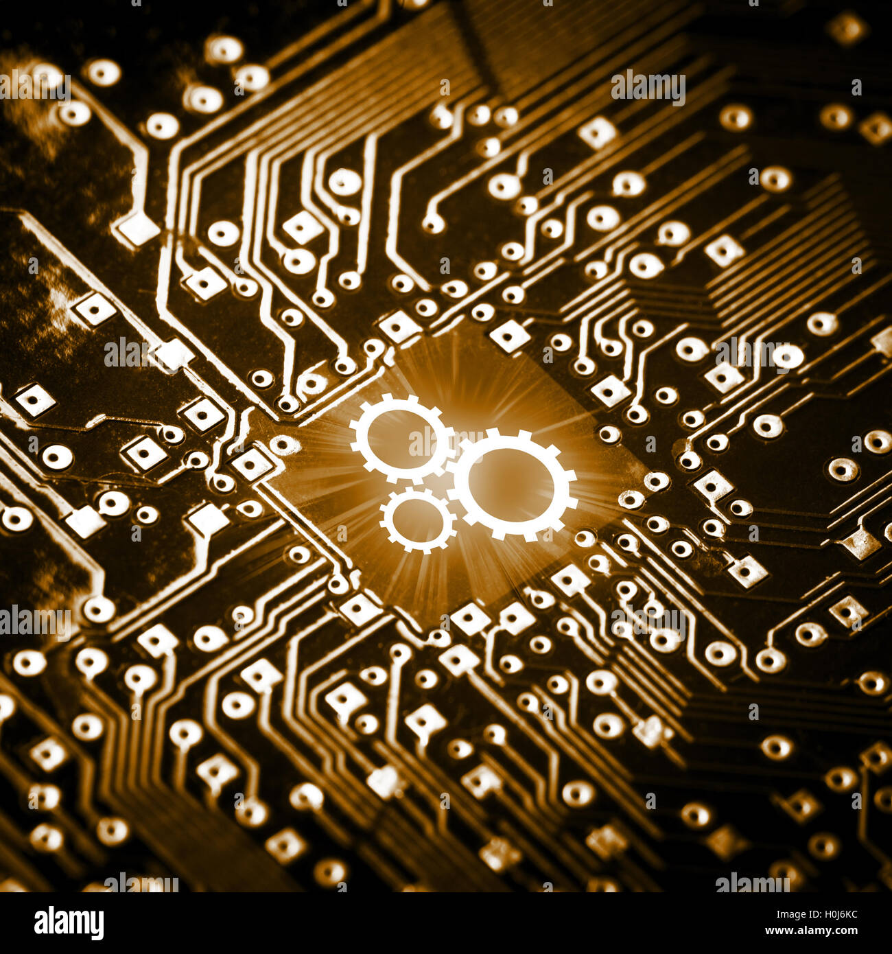 Gears icon on computer chip Stock Photo - Alamy