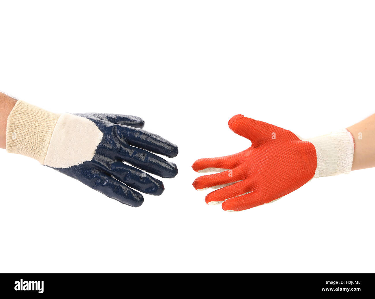 Two hands in gloves meet of hand shake Stock Photo - Alamy