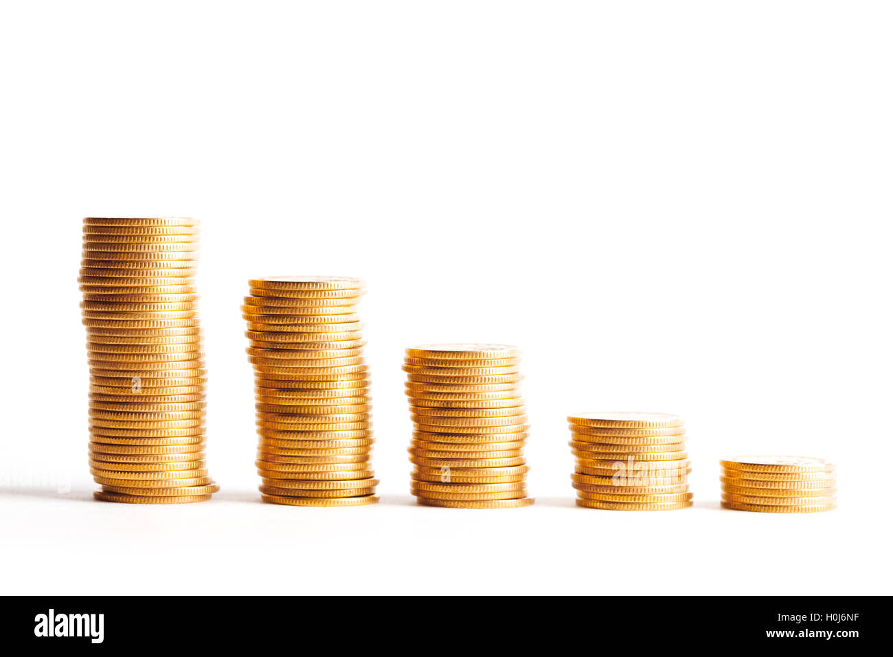 Coin stacks on a white background Stock Photo - Alamy