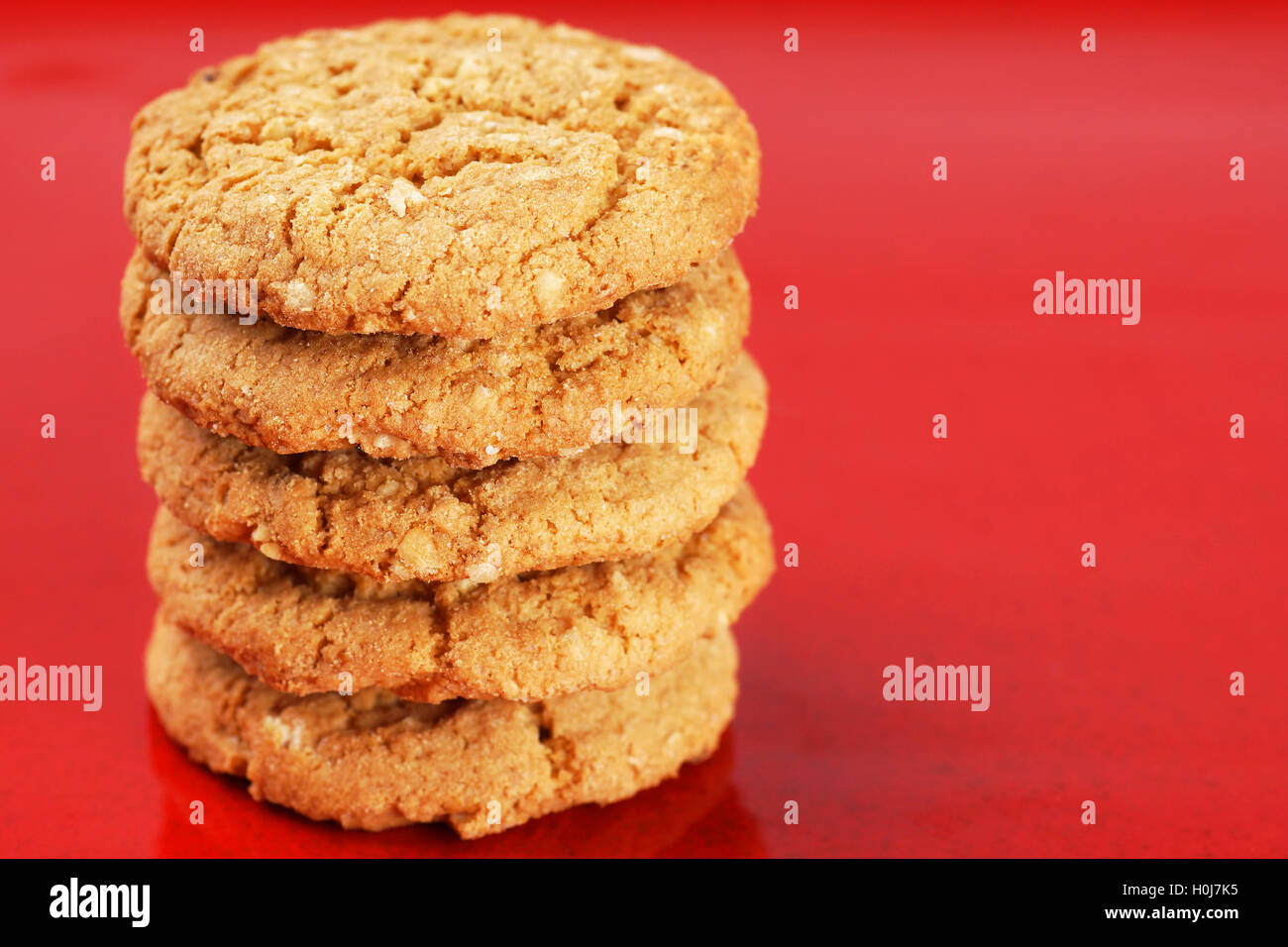 Stack of peanut butter cookies on red Stock Photo - Alamy