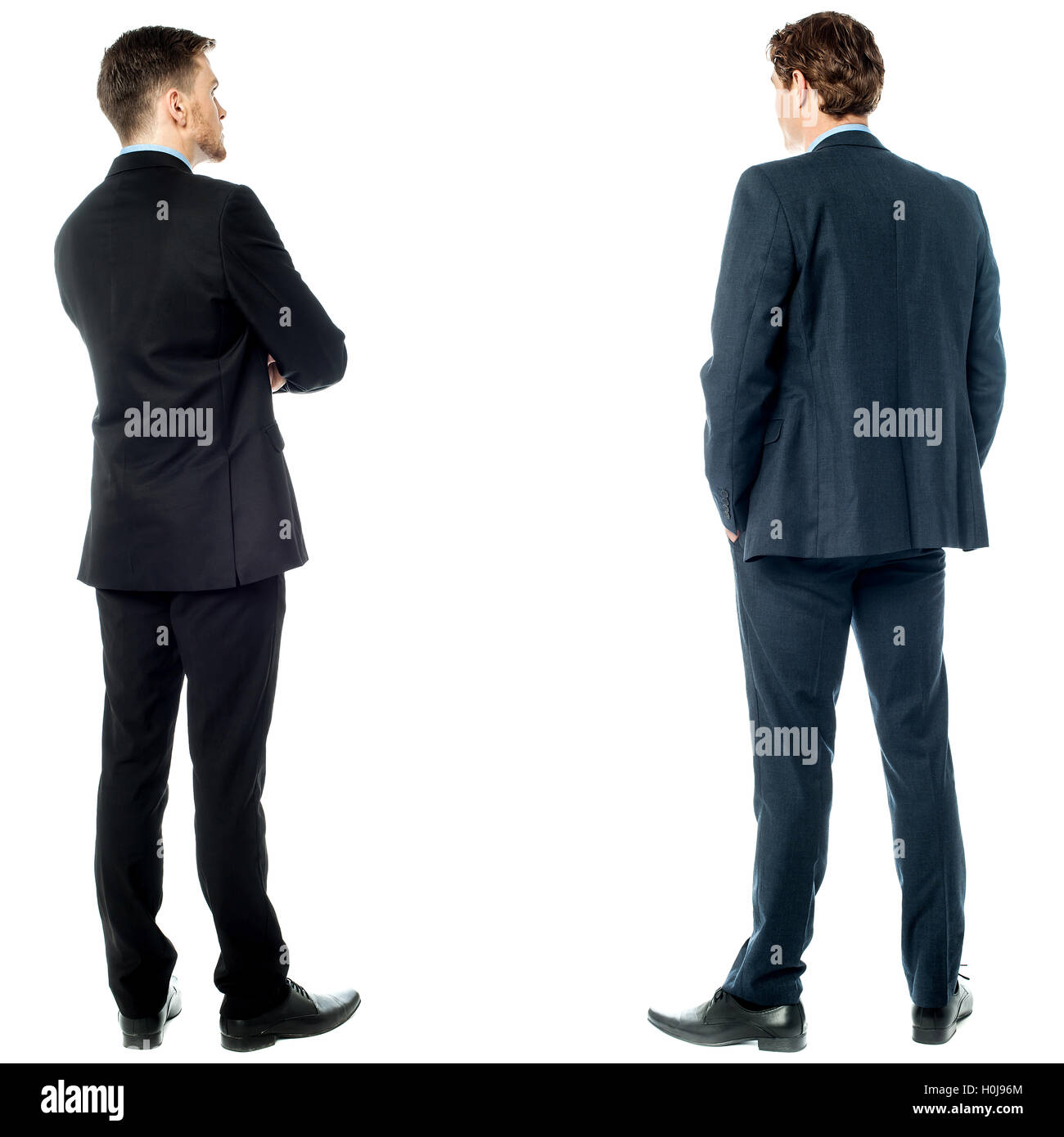 Back pose of handsome young corporates Stock Photo - Alamy