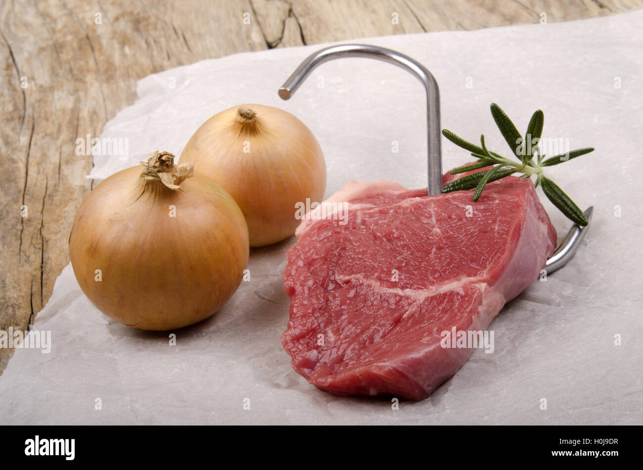 pork steak on a butchers hook Stock Photo - Alamy