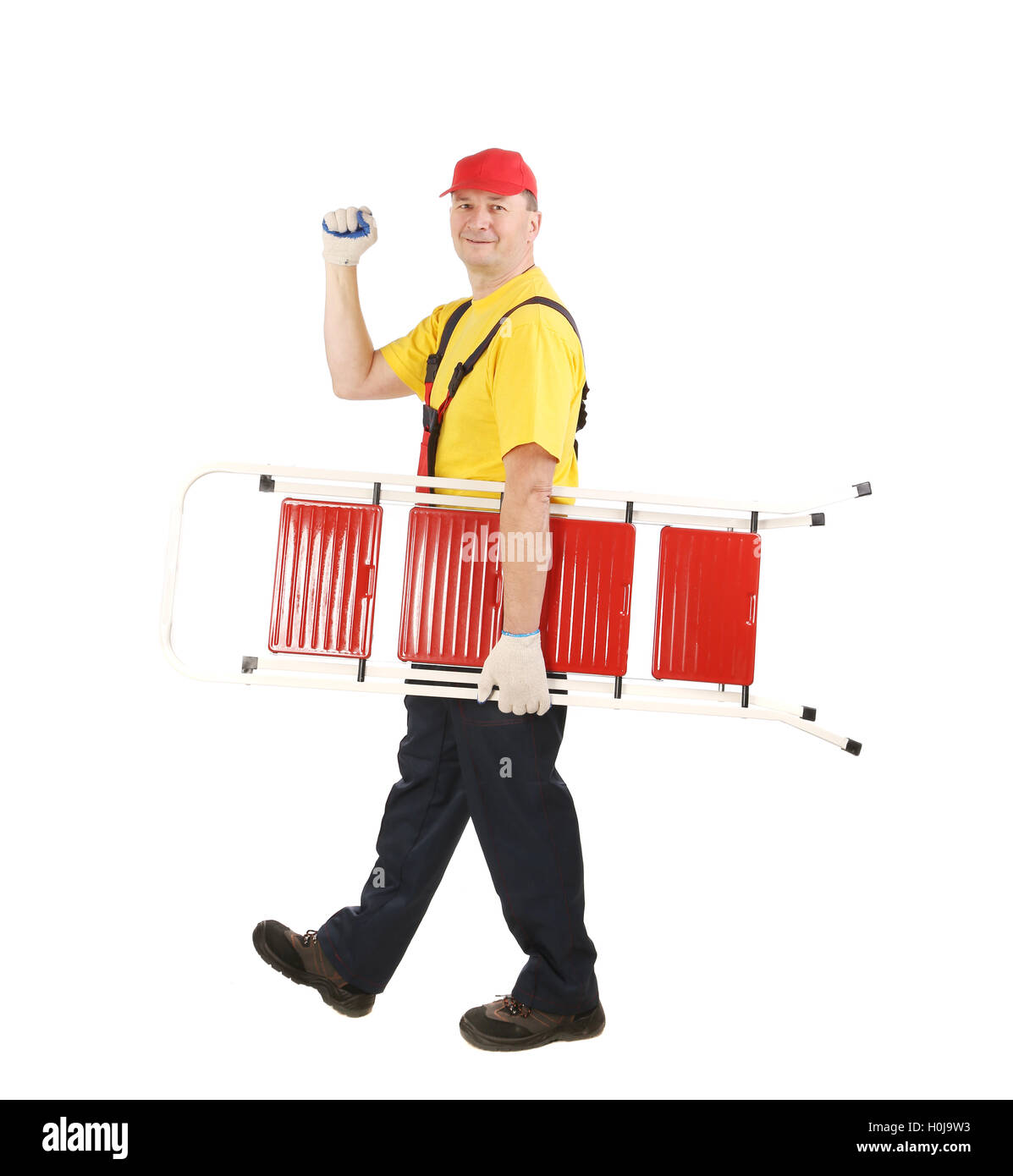 Worker with ladder smiling Stock Photo - Alamy