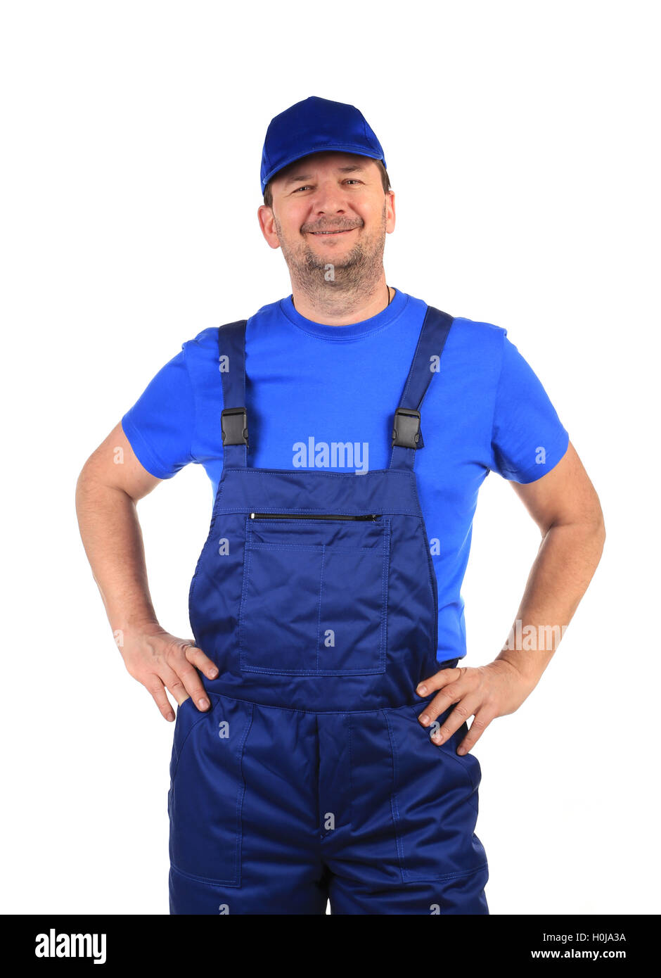 Worker in blue overalls Stock Photo - Alamy