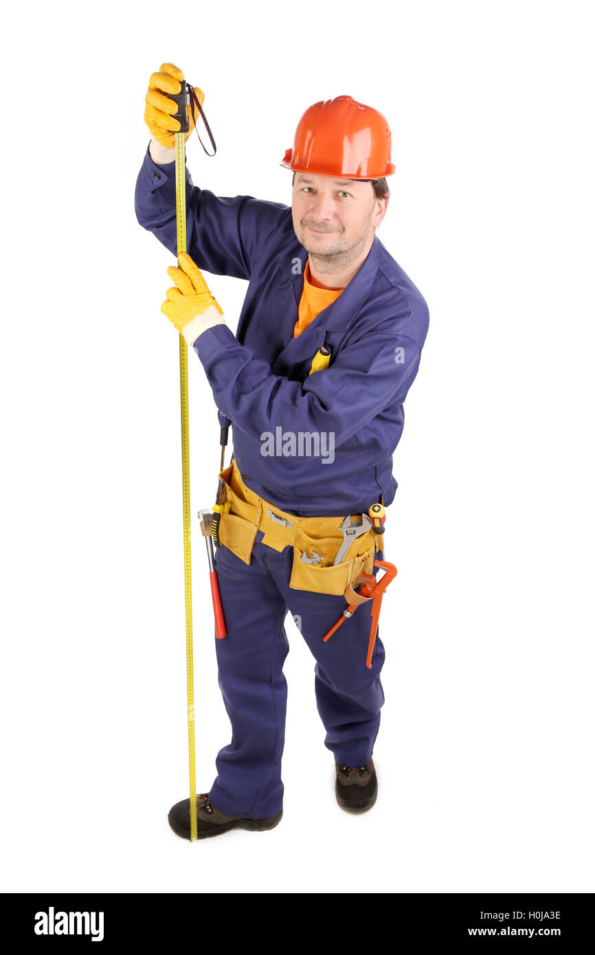 Worker in hard hat measure with ruler Stock Photo - Alamy