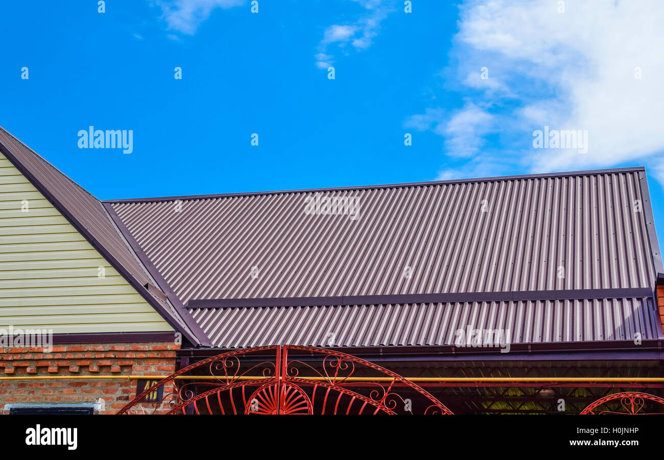 The roof of corrugated sheet. Roofing of metal profile wavy shape Stock ...