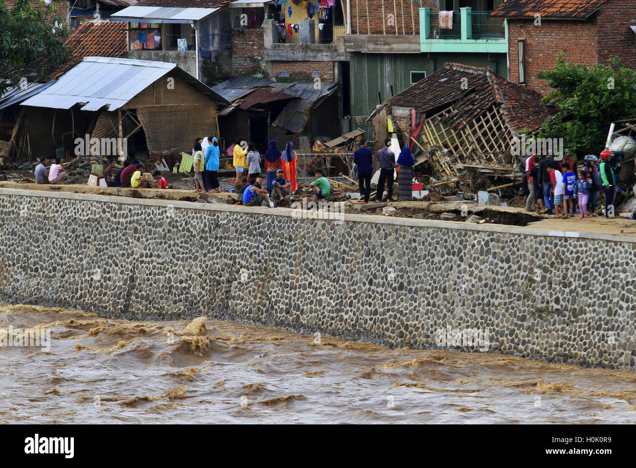 West Java, Indonesia. 21st Sep, 2016. Villagers rest in front of the ...