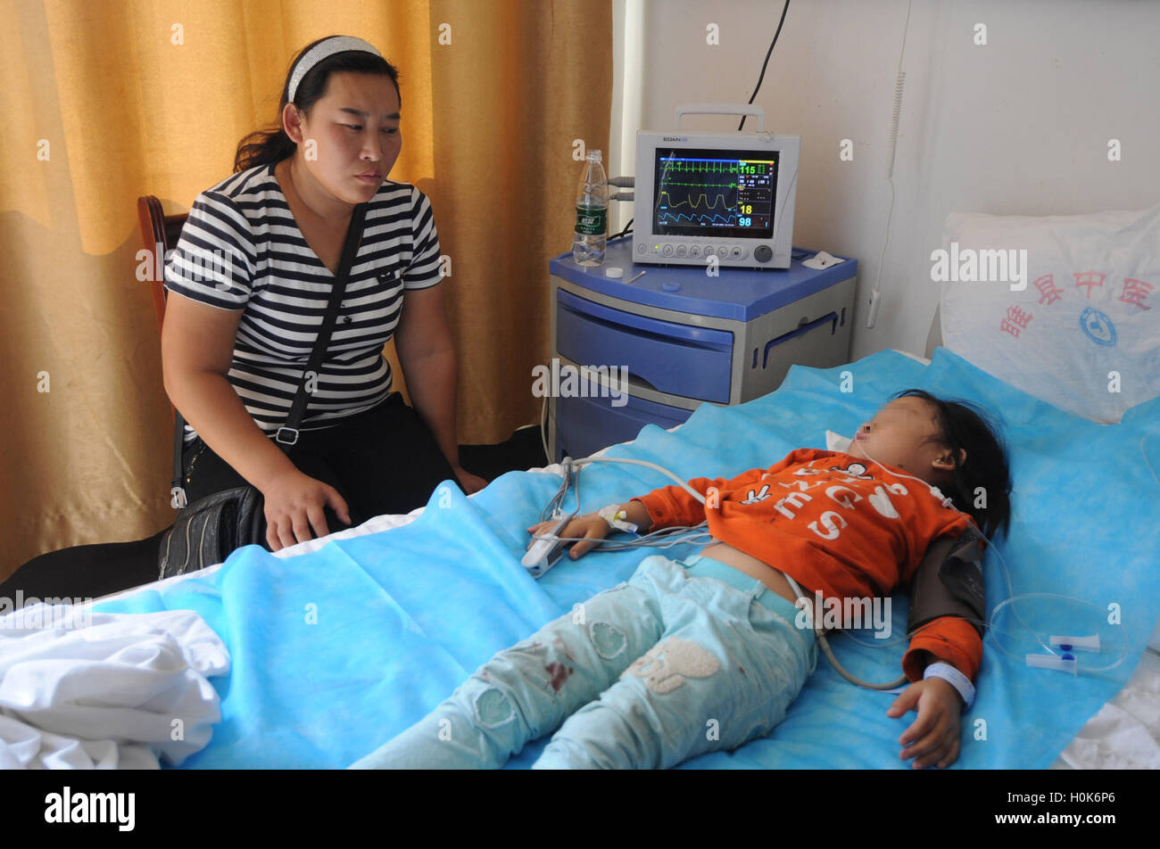 Suixian. 22nd Sep, 2016. An injured child receives medical treatment in ...