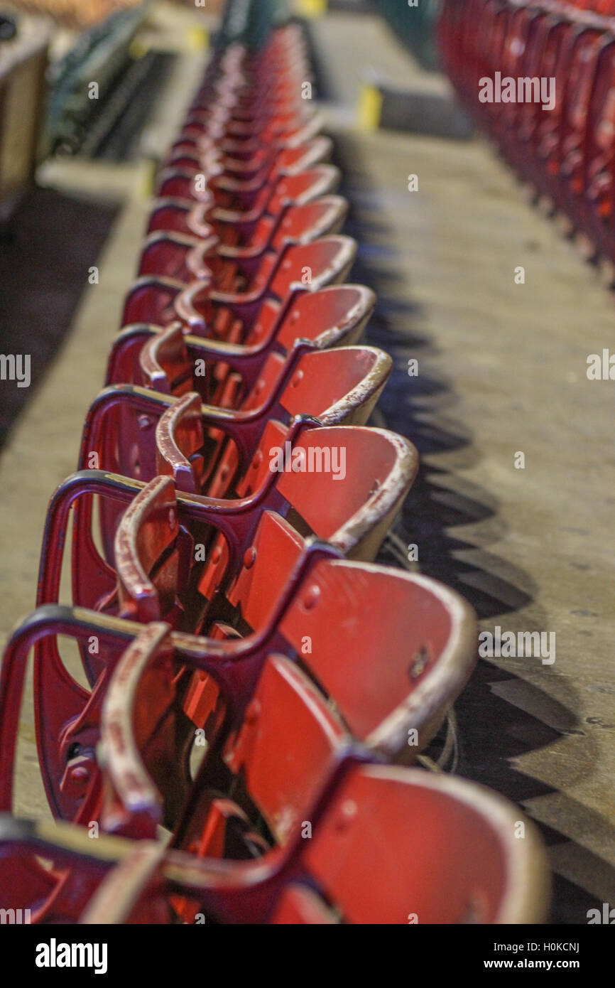 Single row of red arena chairs Stock Photo - Alamy