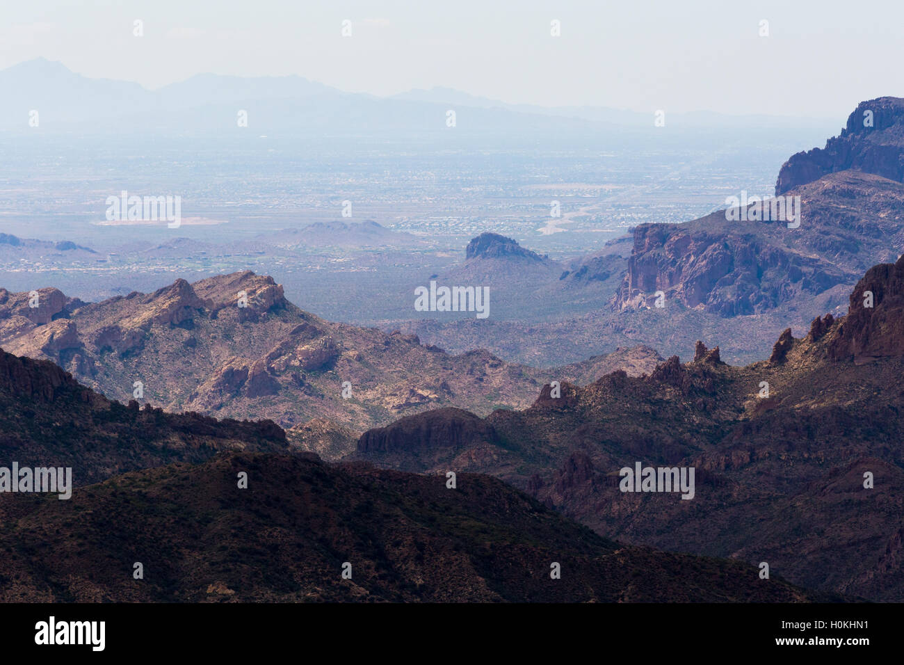 Phoenix sprawling out below the base of the Superstition Mountains far ...