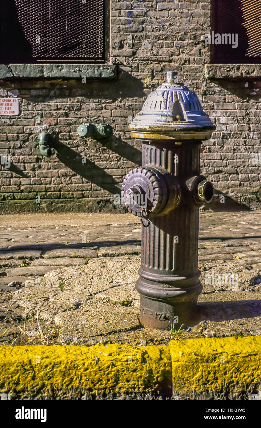 Fire hydrant on sidewalk Stock Photo - Alamy
