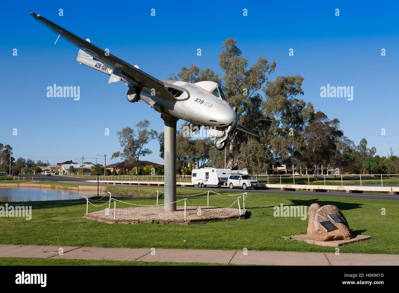 Car and caravan passing the De Havilland Vampire Jet memorial Forbes ...