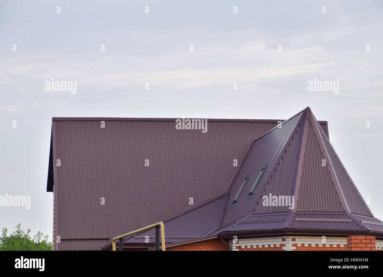 The roof of corrugated sheet. Roofing of metal profile wavy shape Stock ...