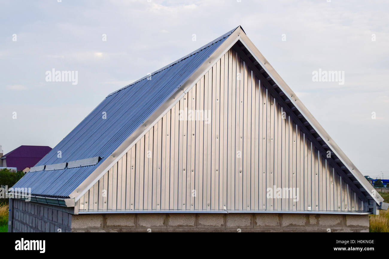 The roof of corrugated sheet. Roofing of metal profile wavy shape Stock ...