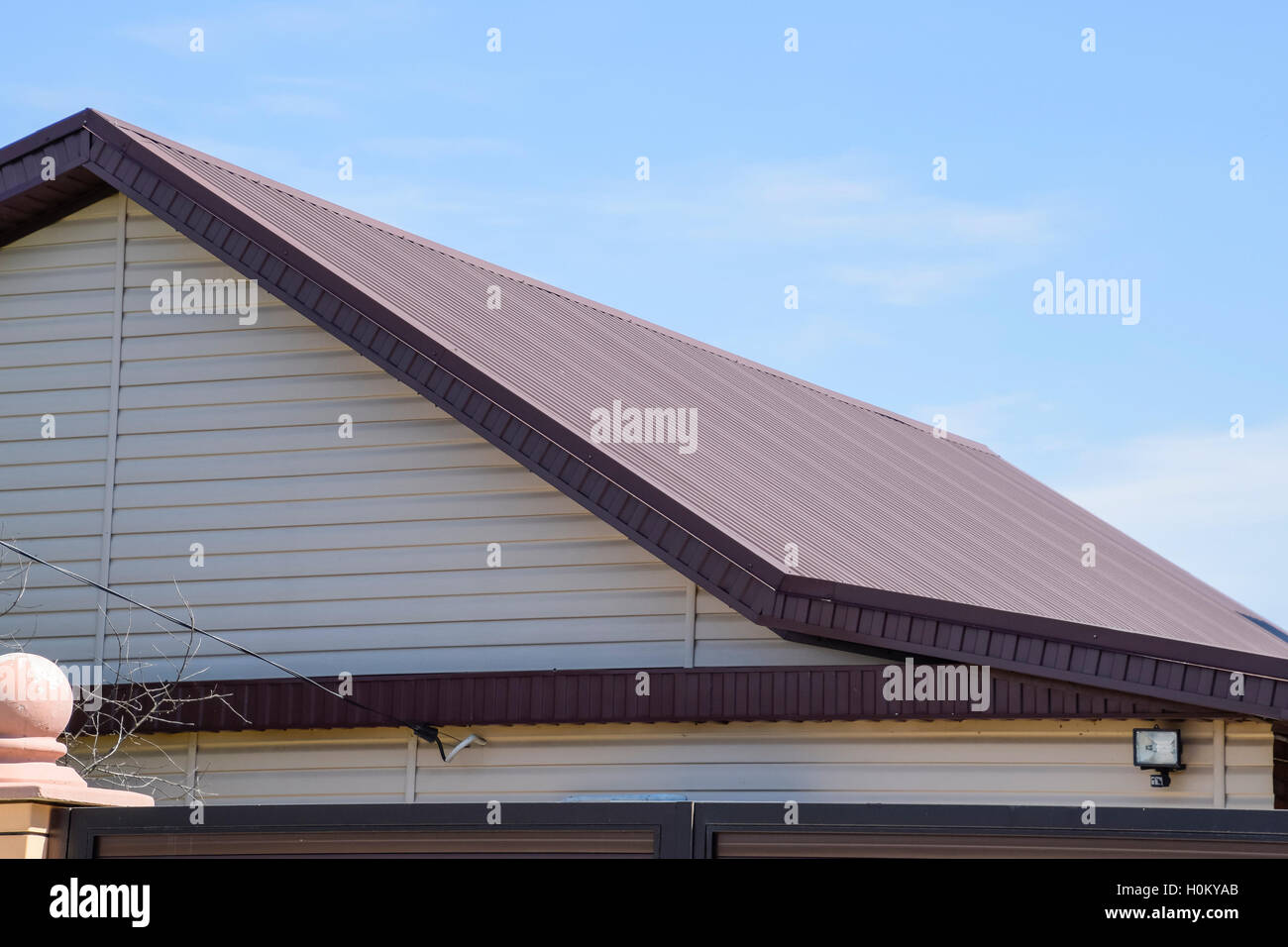 The roof of corrugated sheet. Roofing of metal profile wavy shape Stock ...