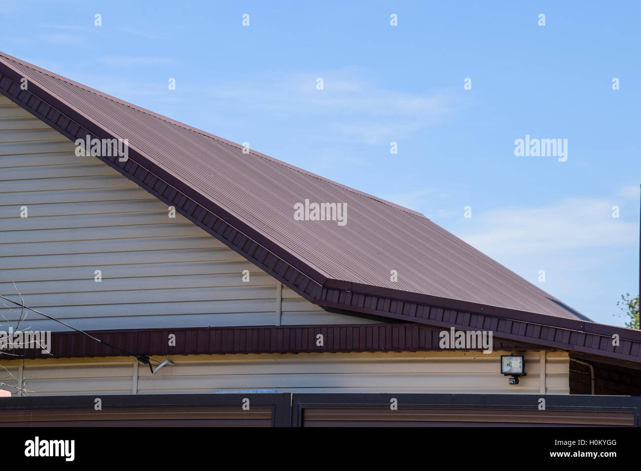 The roof of corrugated sheet. Roofing of metal profile wavy shape Stock ...
