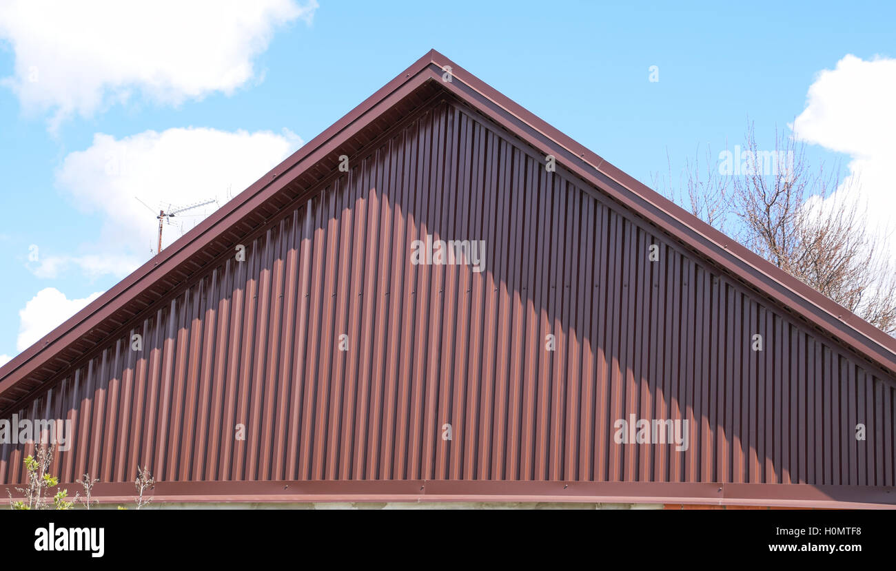 The roof of corrugated sheet. Roofing of metal profile wavy shape Stock ...
