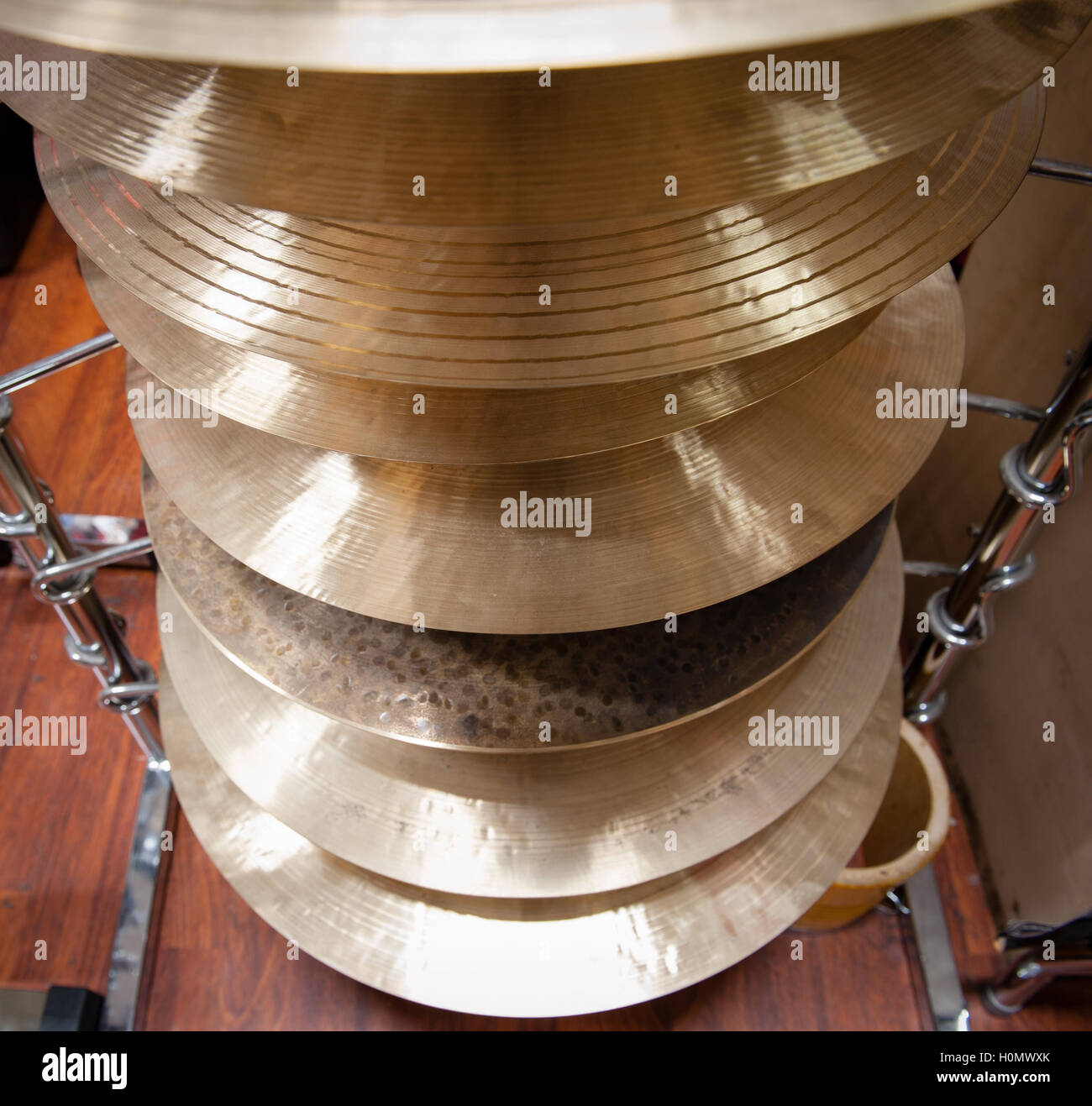 Pile of many different surface crash cymbal drum plates in shop ...