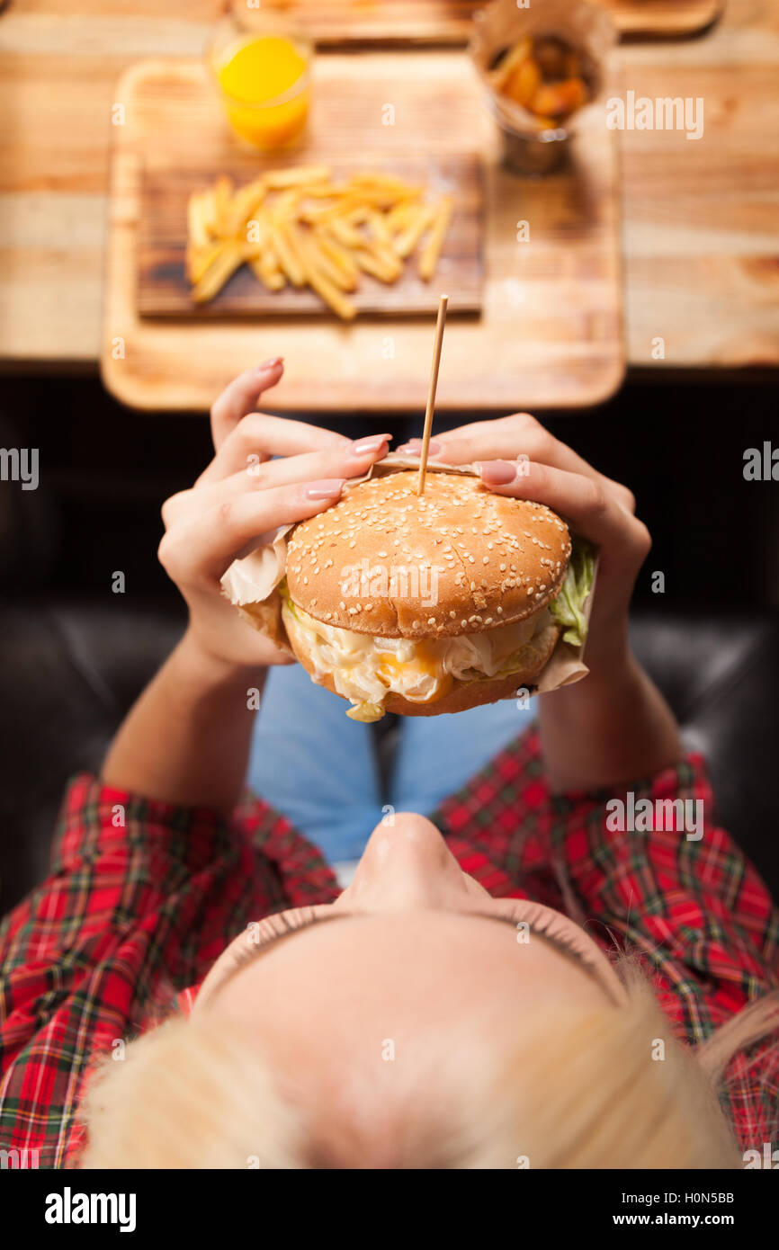 Beautiful Blonde Woman Eat Beef Burger Top Angle View Stock Photo - Alamy