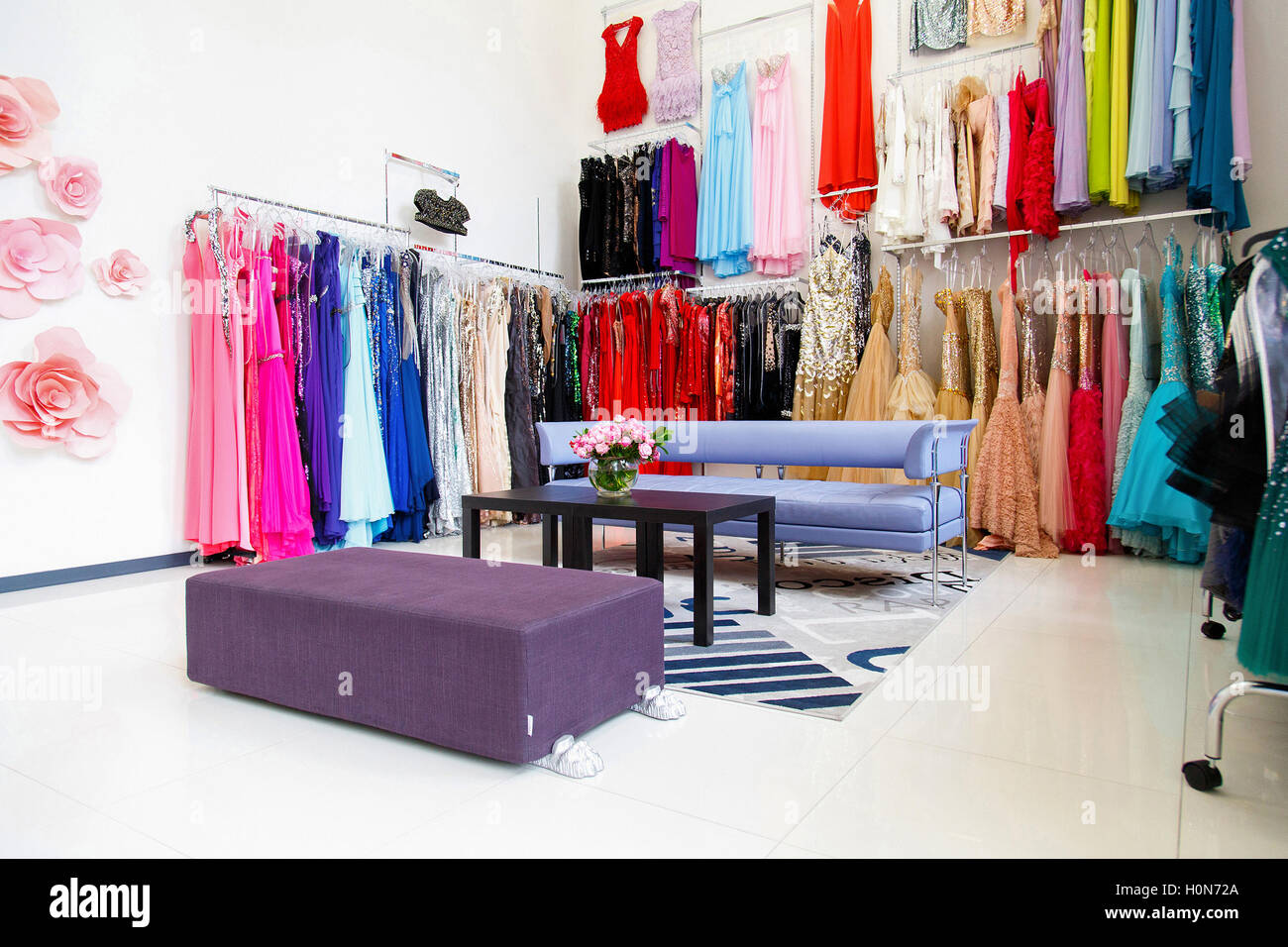 Dress shop with evening dresses on hangers Stock Photo - Alamy