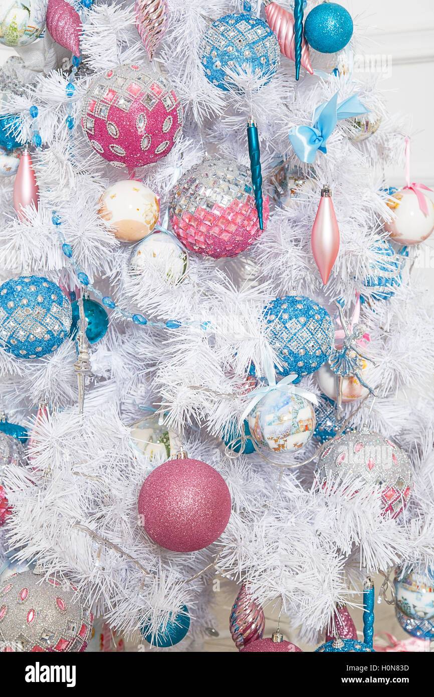 White fir-tree with pink and blue Christmas toys Stock Photo - Alamy