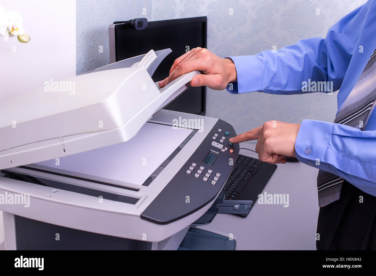 Businessman working with printer in the office Stock Photo - Alamy