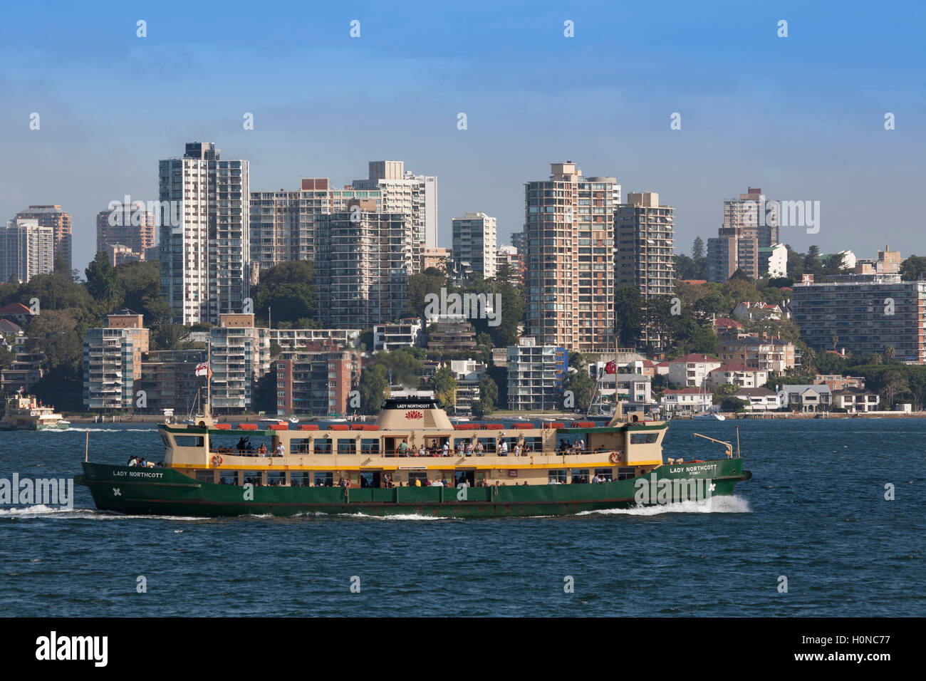 Sydney Harbour Ferry Lady Northcott passing the harbour side suburb of ...