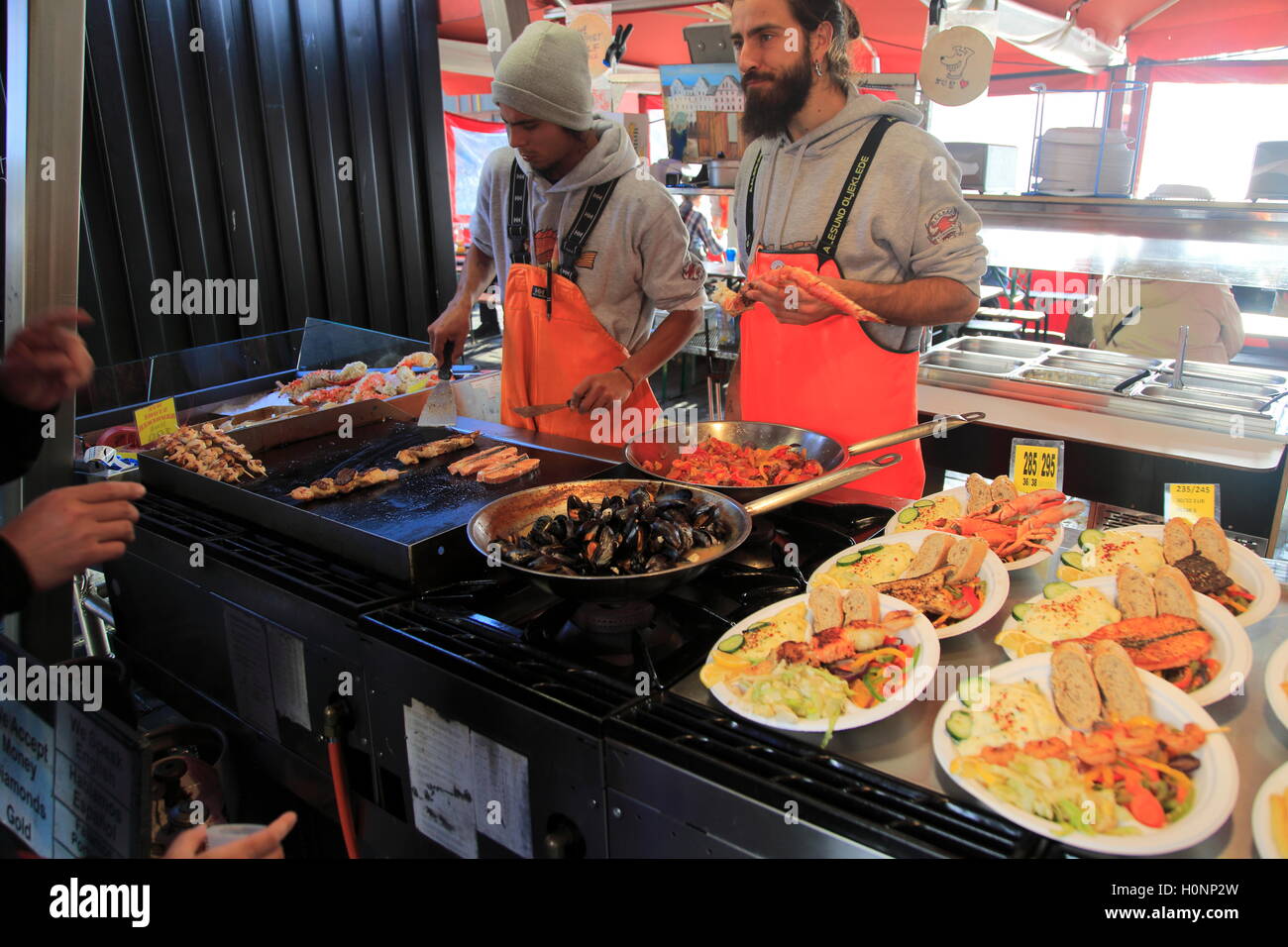 Street stall restaurant cooking fish meals in Torget market, Bergen ...