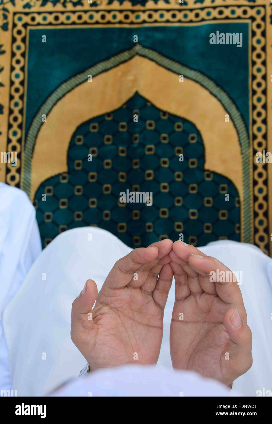 A Muslim man offers prayer as he celebrates Eid al-Adha or festival of ...