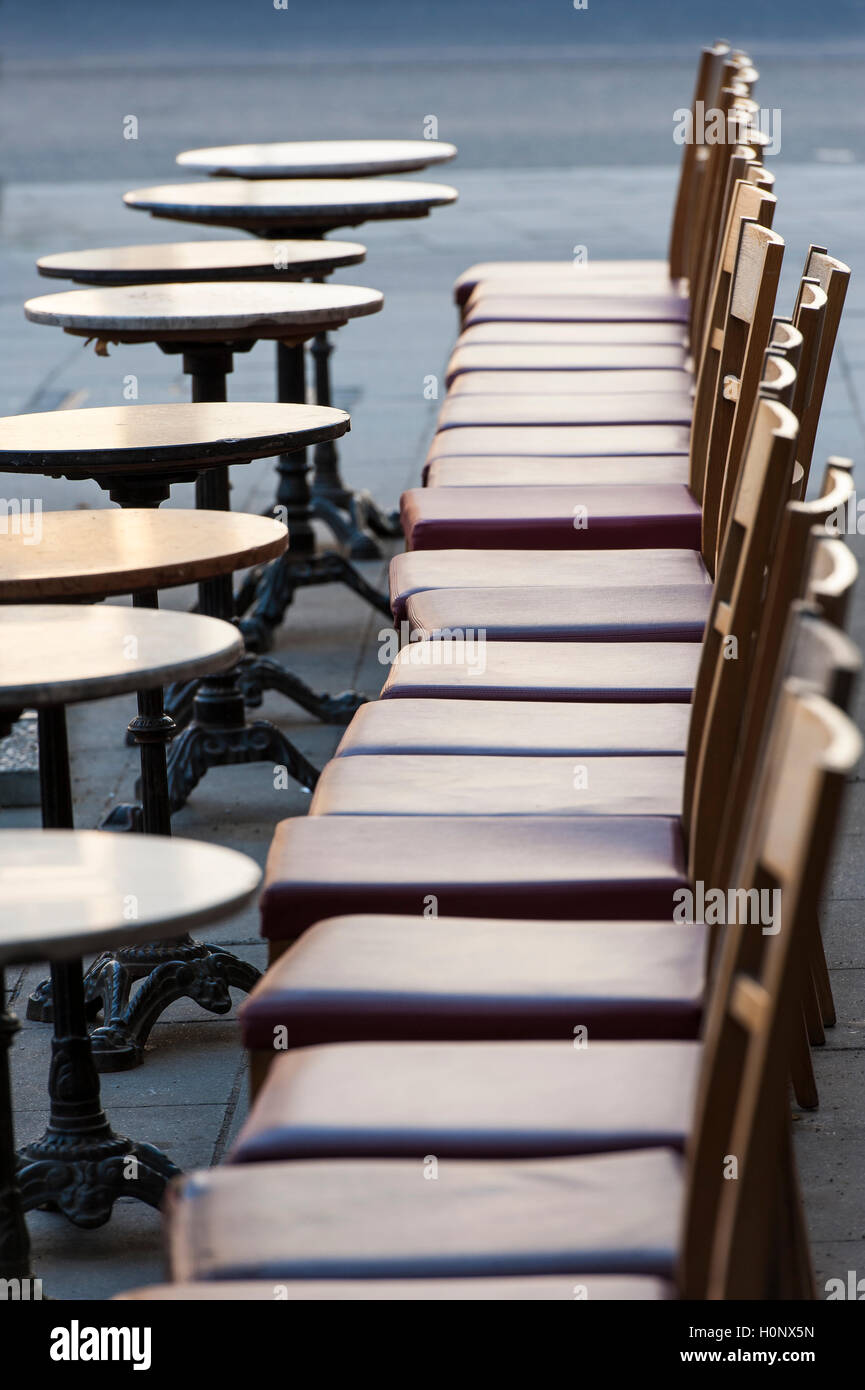 Row of wooden chairs with bistro tables, Munich, Bavaria, Germany Stock ...
