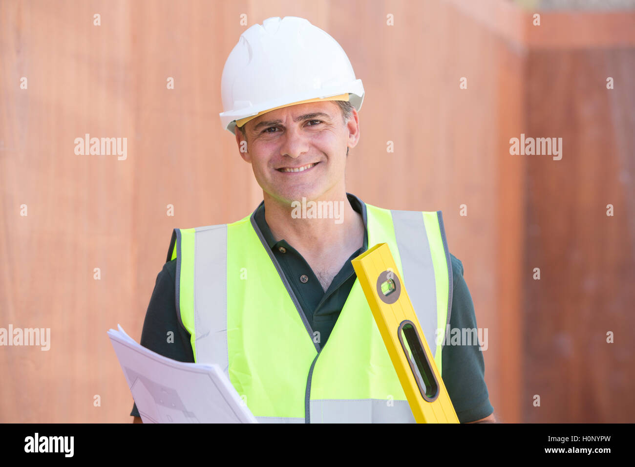 Portrait Of Construction Worker On Building Site With House Plans Stock ...