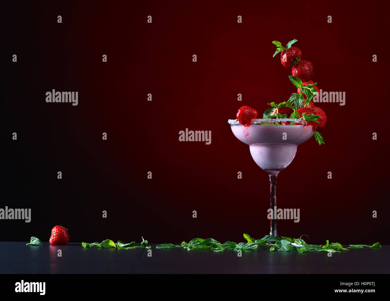 strawberry cocktail with berries and peppermint leaves Stock Photo - Alamy