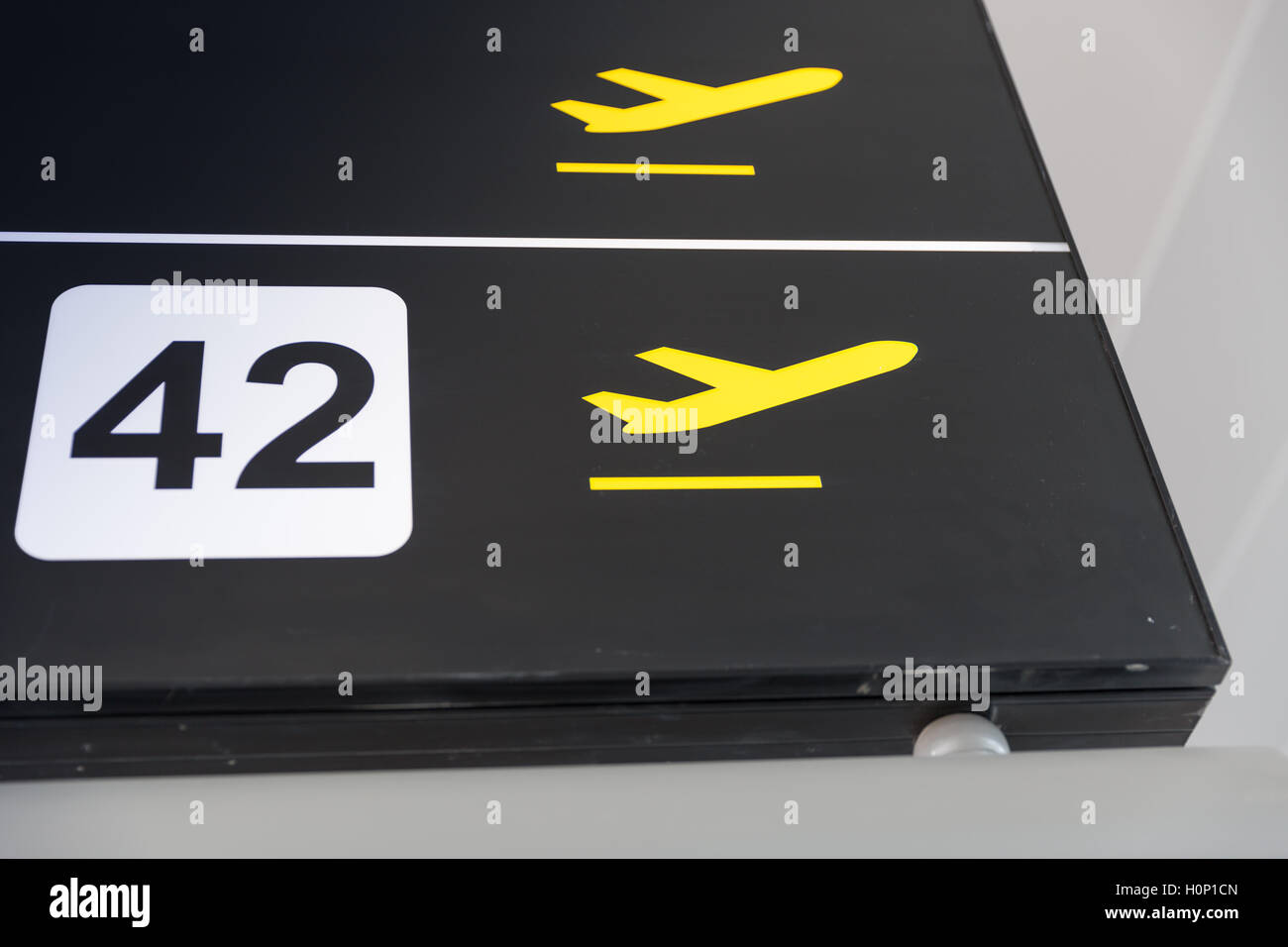 Black Airport Pointers - Gate direction Stock Photo - Alamy