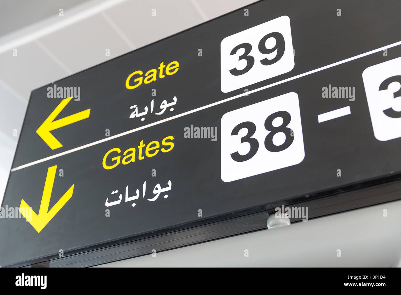 Black Airport Pointers - Gate direction Stock Photo - Alamy