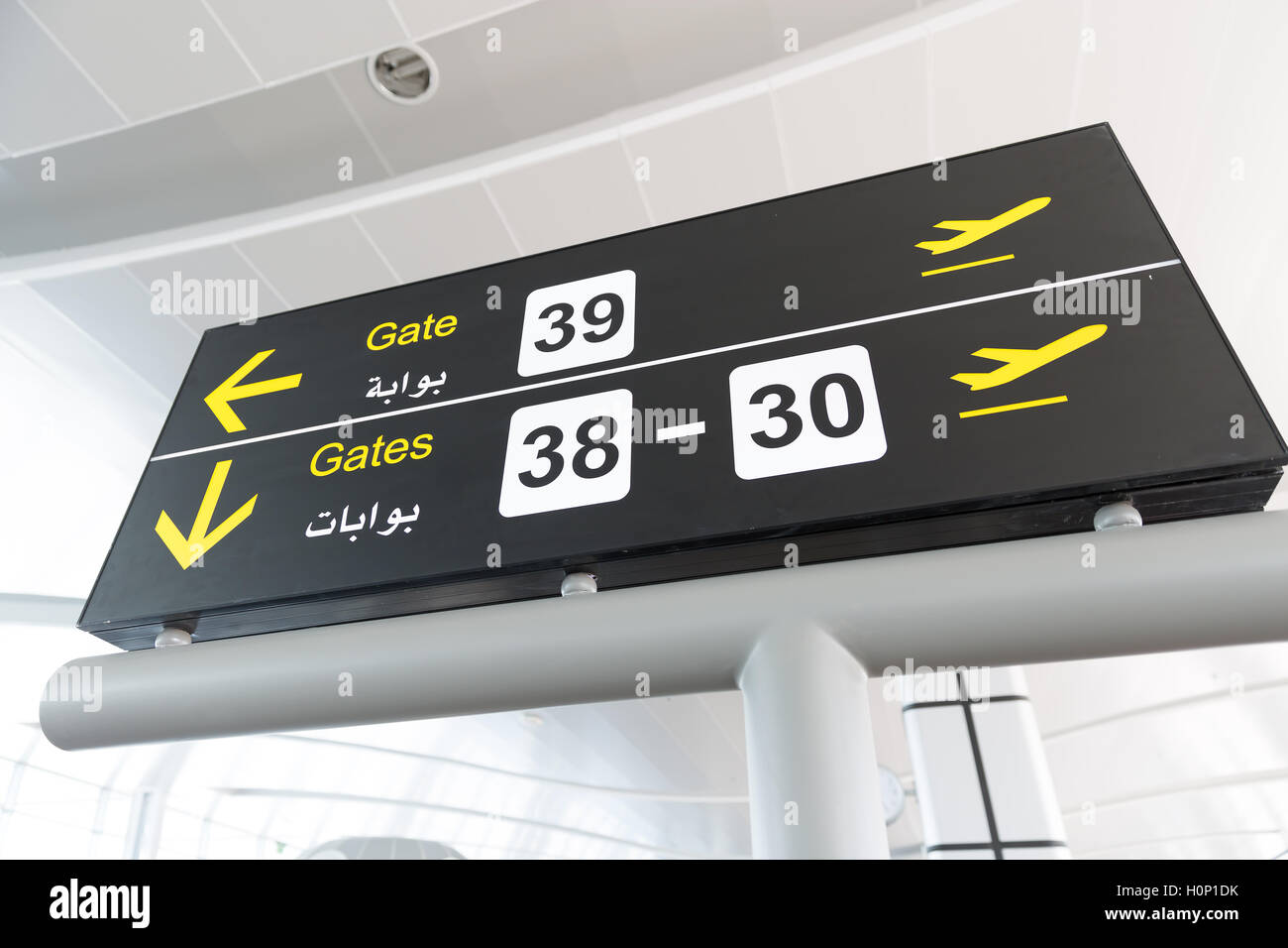 Black Airport Pointers - Gate direction Stock Photo - Alamy