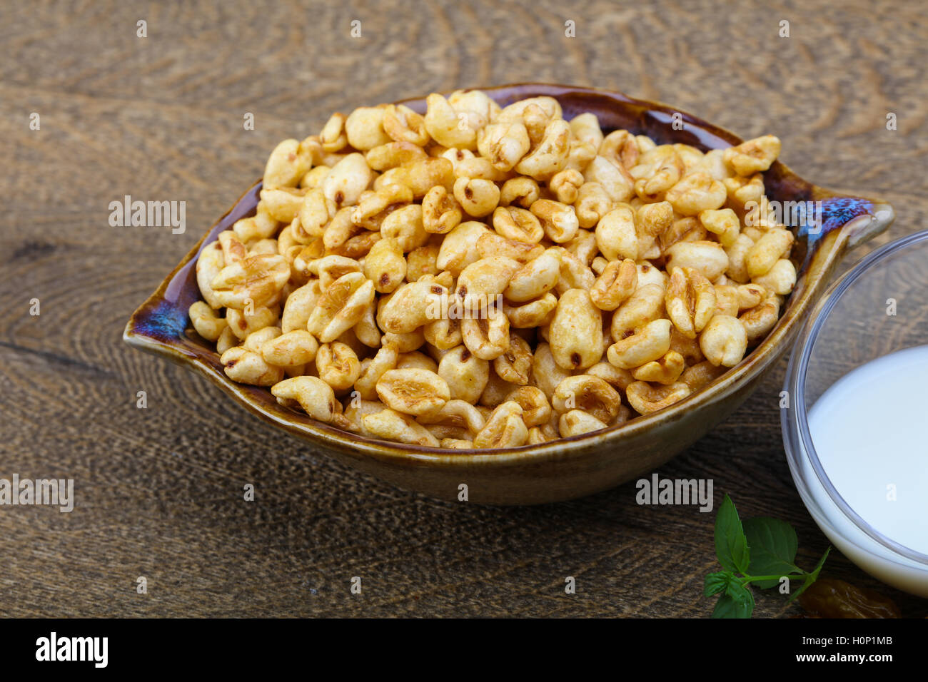 Rise flakes with milk, raisin and mint leaves Stock Photo - Alamy