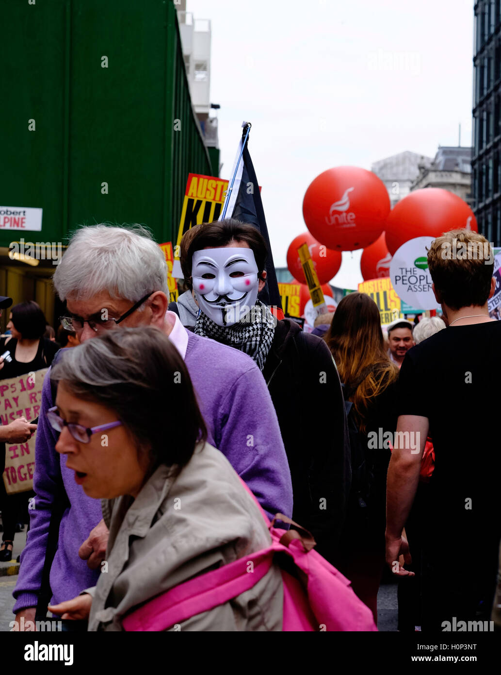 Protestor wearing Guy Fawkes mask at anti-austerity protest in London ...