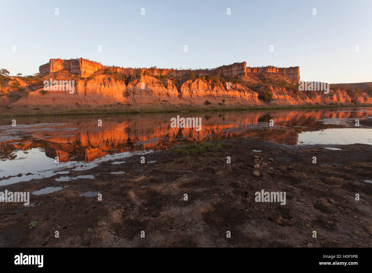 Panoramic view of the Chilojo Cliffs and their reflection in a body of ...