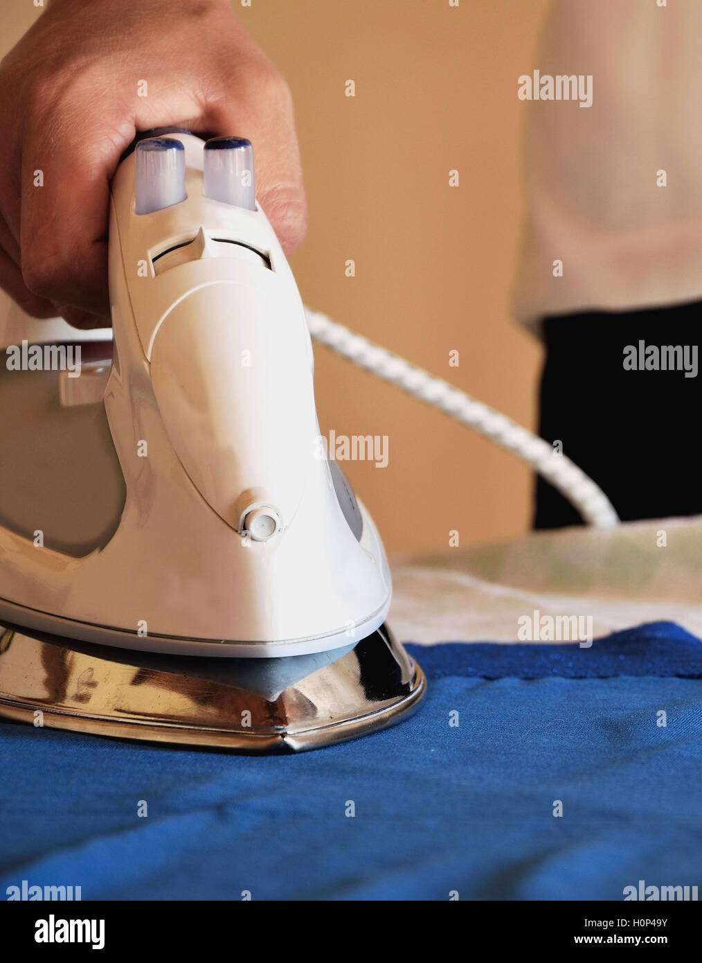 Women ironing cloths hi-res stock photography and images - Alamy