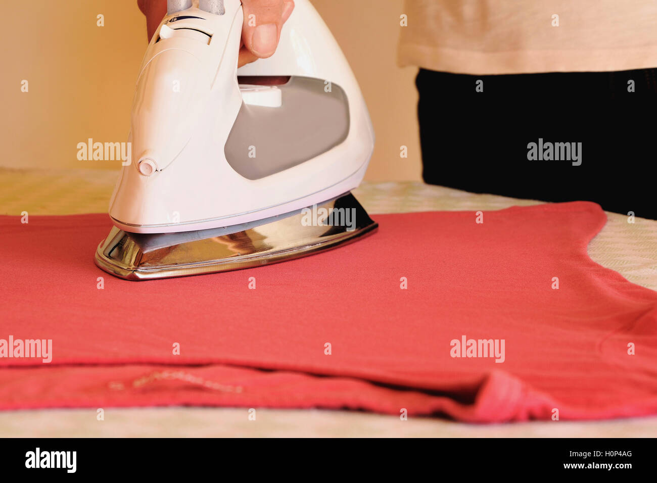 Women ironing cloths hi-res stock photography and images - Alamy