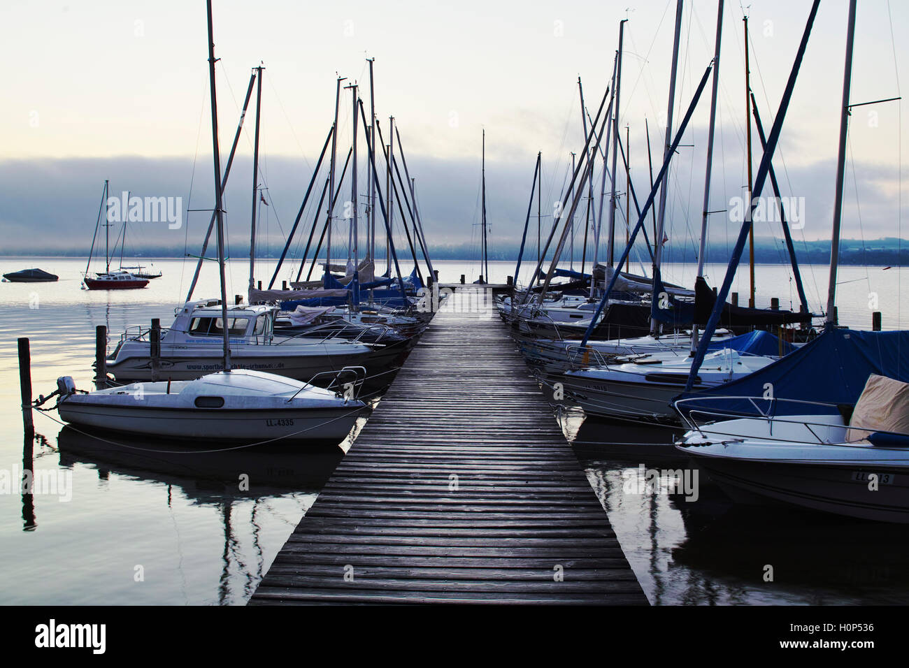 boat landing stage at lake early morning Stock Photo - Alamy