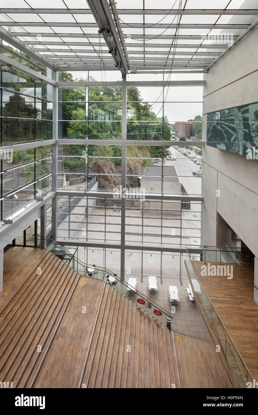 Atrium and main timber staircase seen from upper level with view over ...