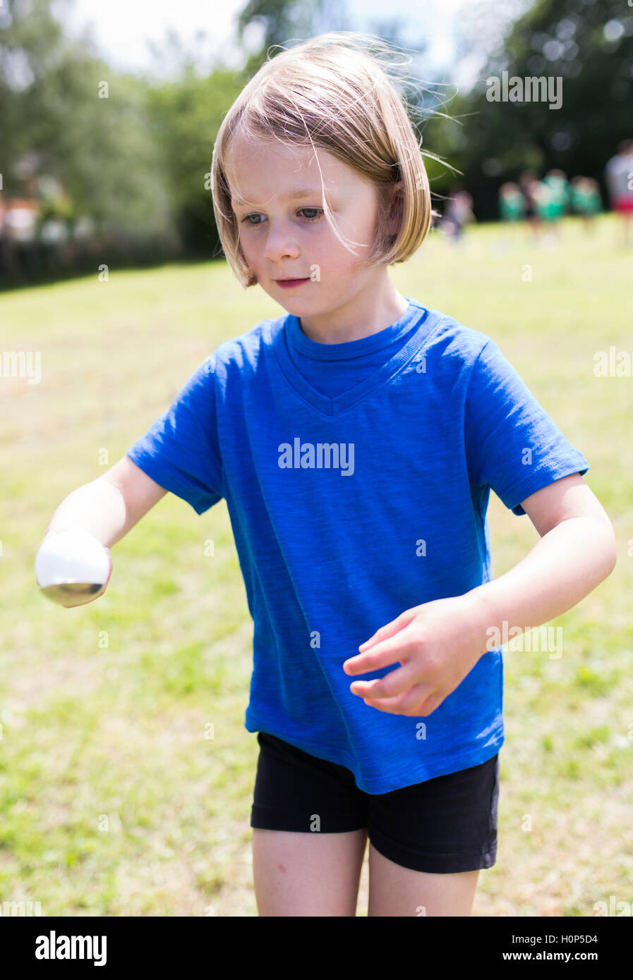 girl running egg and spoon race Stock Photo - Alamy