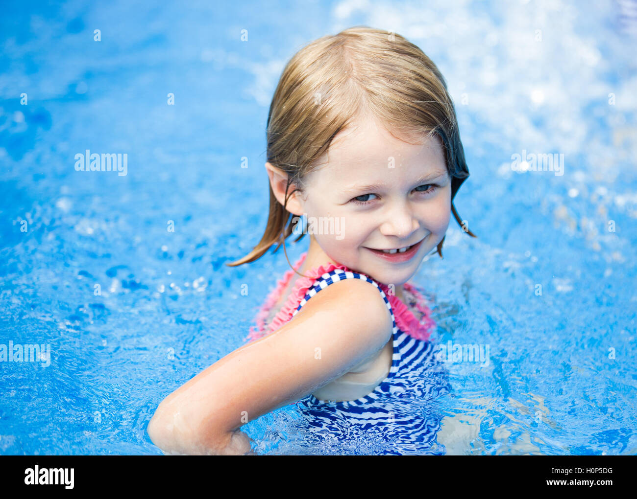 small girl in pool standing Stock Photo - Alamy