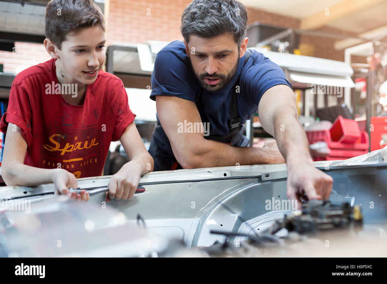 father son fixing car engine Stock Photo - Alamy