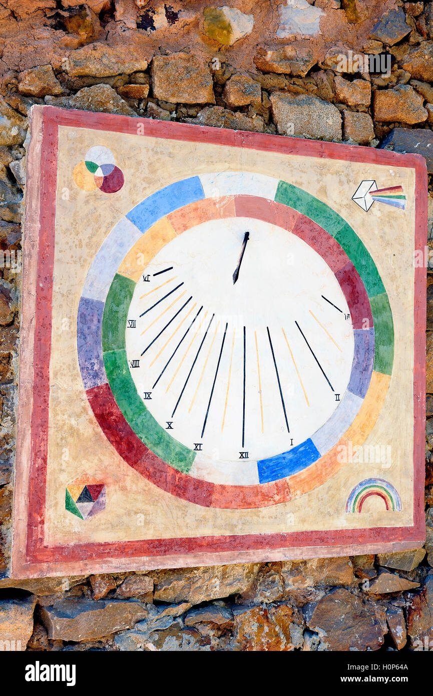 a modern and colorful sundial on a wall Stock Photo - Alamy