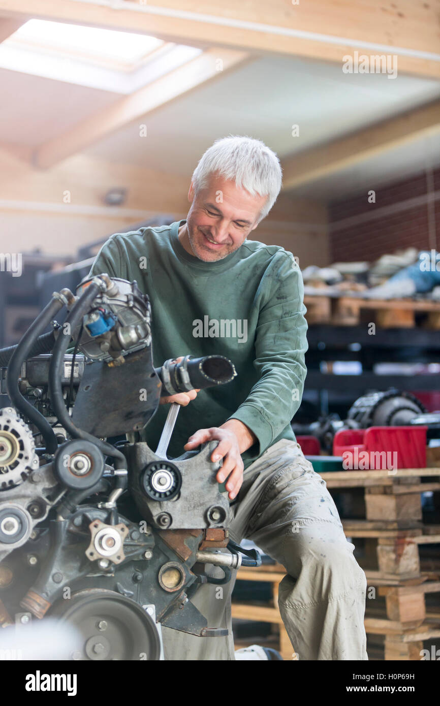 mechanic rebuilding engine auto repair shop Stock Photo - Alamy